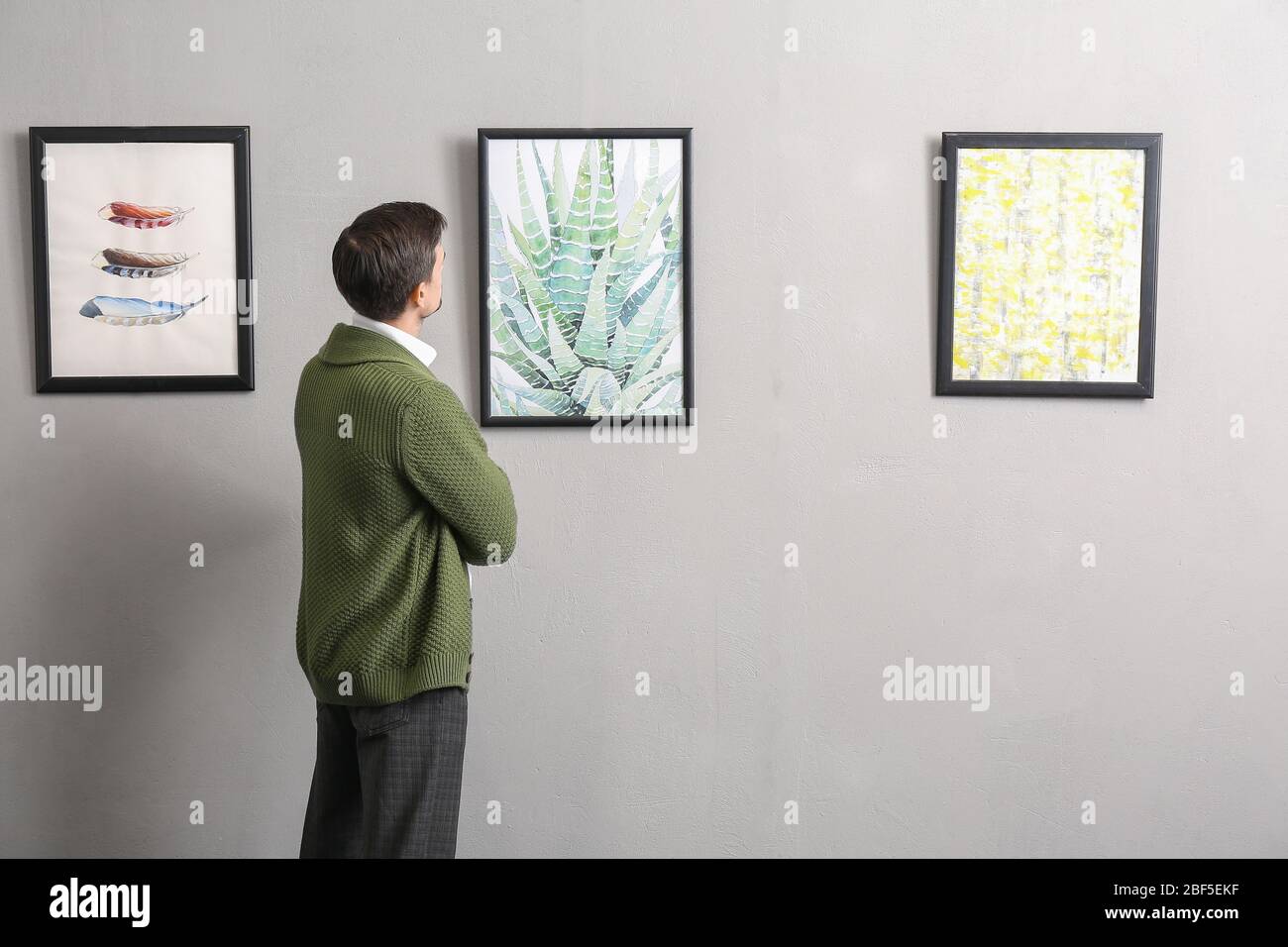 Man at exhibition in modern art gallery Stock Photo - Alamy