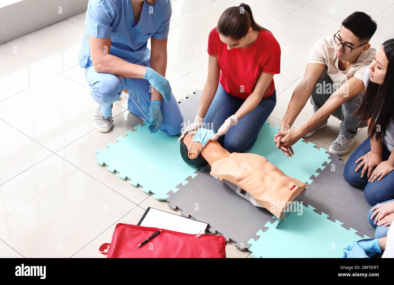 Group of people with instructor at first aid training course Stock ...