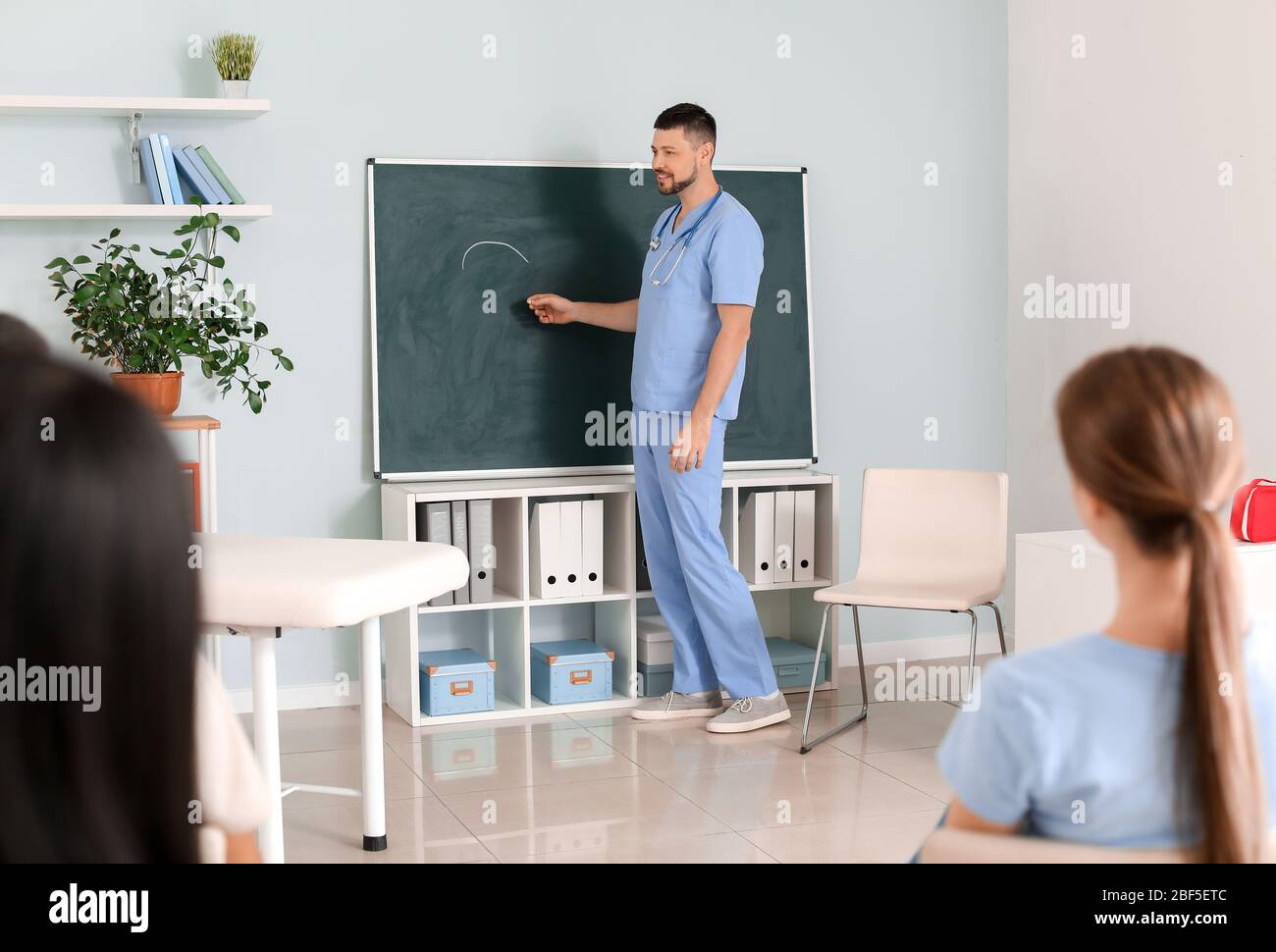 Male instructor at first aid training course Stock Photo - Alamy