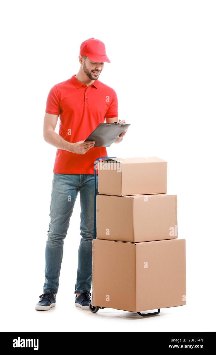 Delivery man with boxes on white background Stock Photo - Alamy