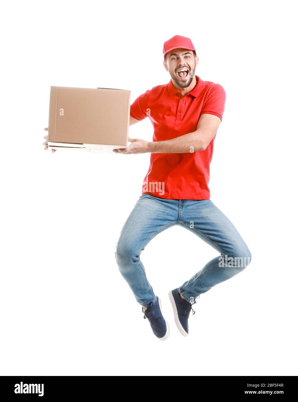 Jumping delivery man with box on white background Stock Photo - Alamy