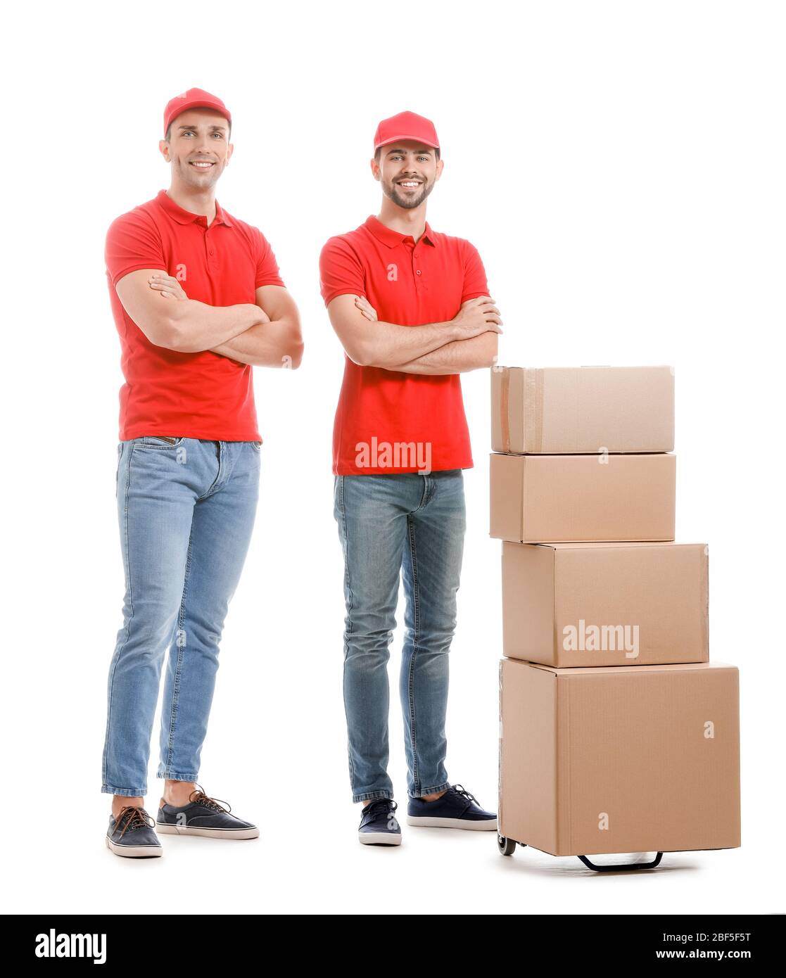 Delivery men with boxes on white background Stock Photo - Alamy