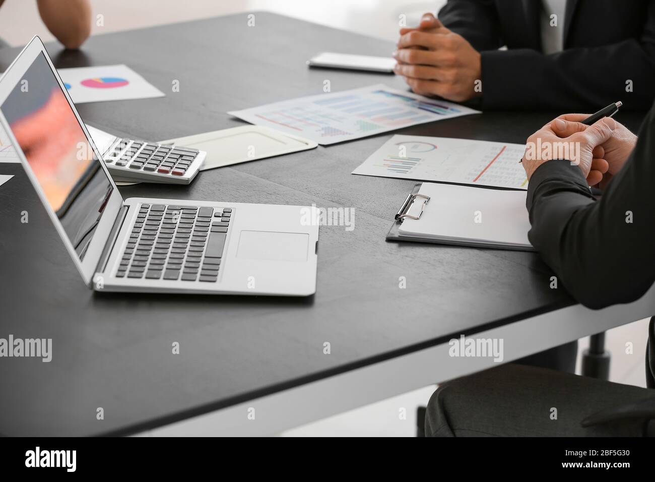 Banker working client table hi-res stock photography and images - Alamy
