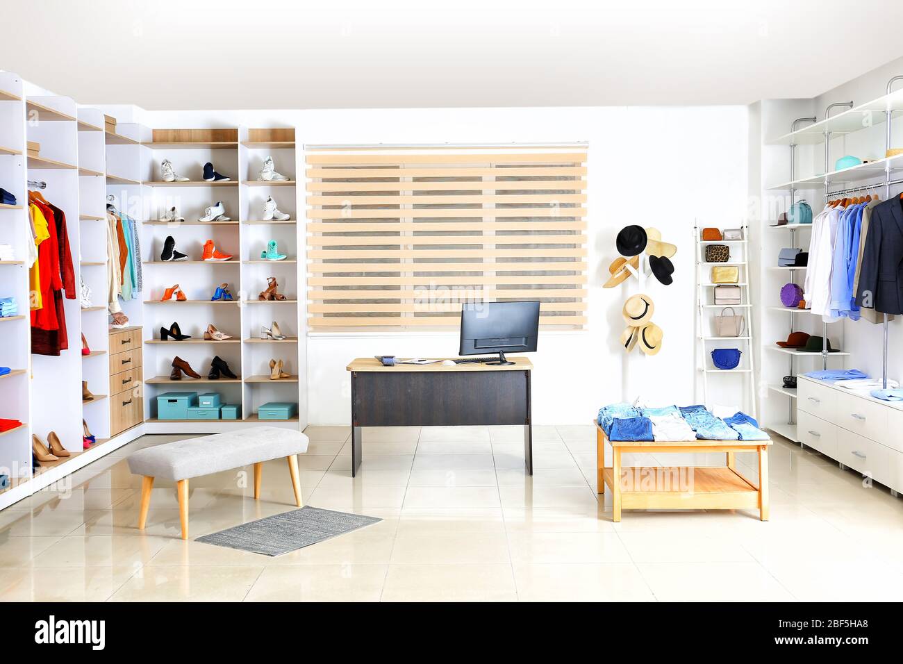 Stylish clothes and accessories in modern store Stock Photo - Alamy