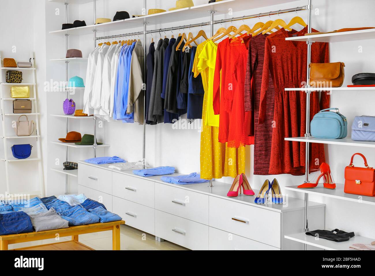 Stylish clothes and accessories in modern store Stock Photo - Alamy