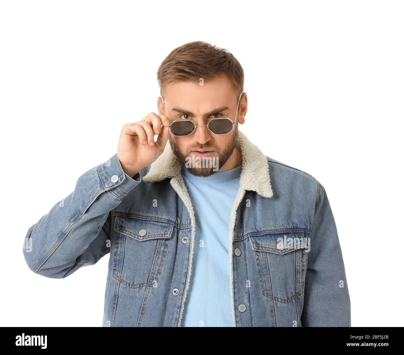 Suspicious man with stylish sunglasses on white background Stock Photo ...