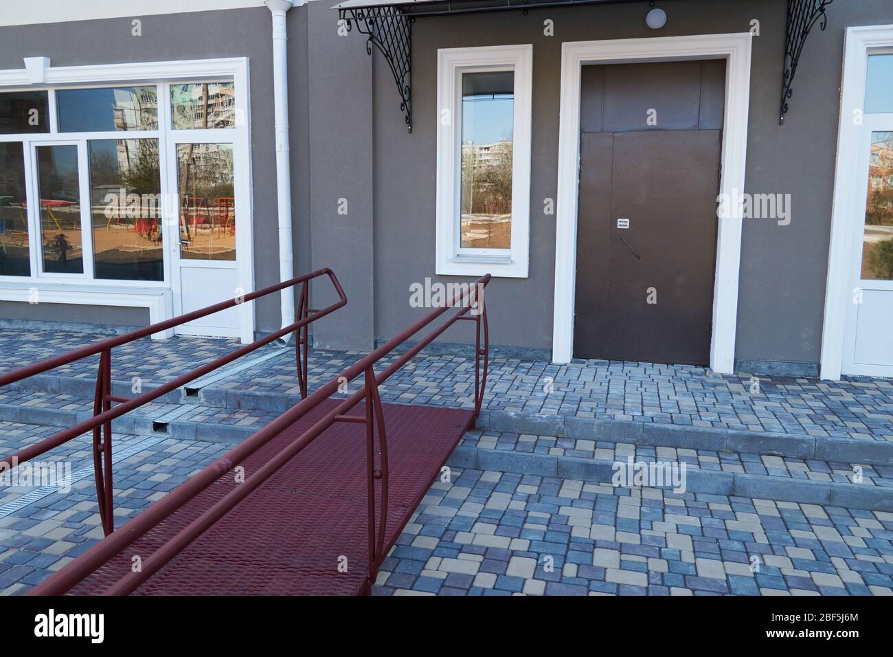 Wheelchair access ramp for entrance of residential multistory building ...
