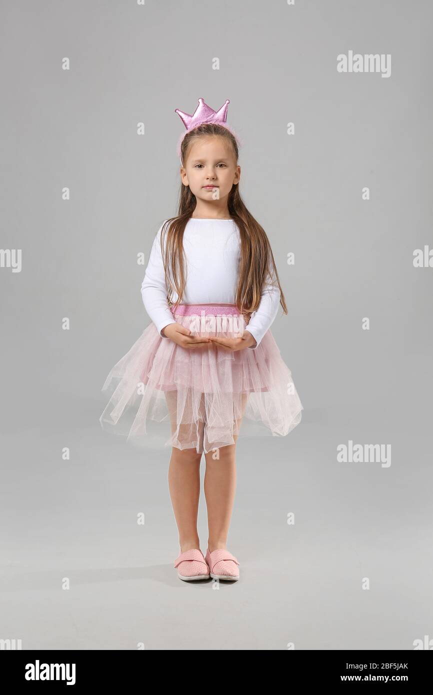 Cute little princess on white background Stock Photo - Alamy