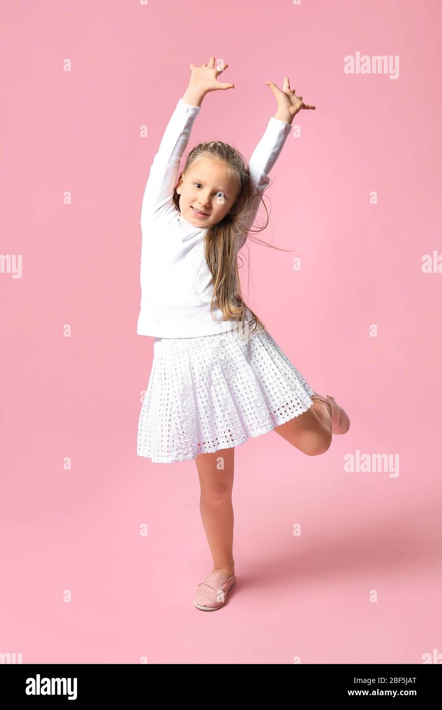 Cute little girl on color background Stock Photo - Alamy