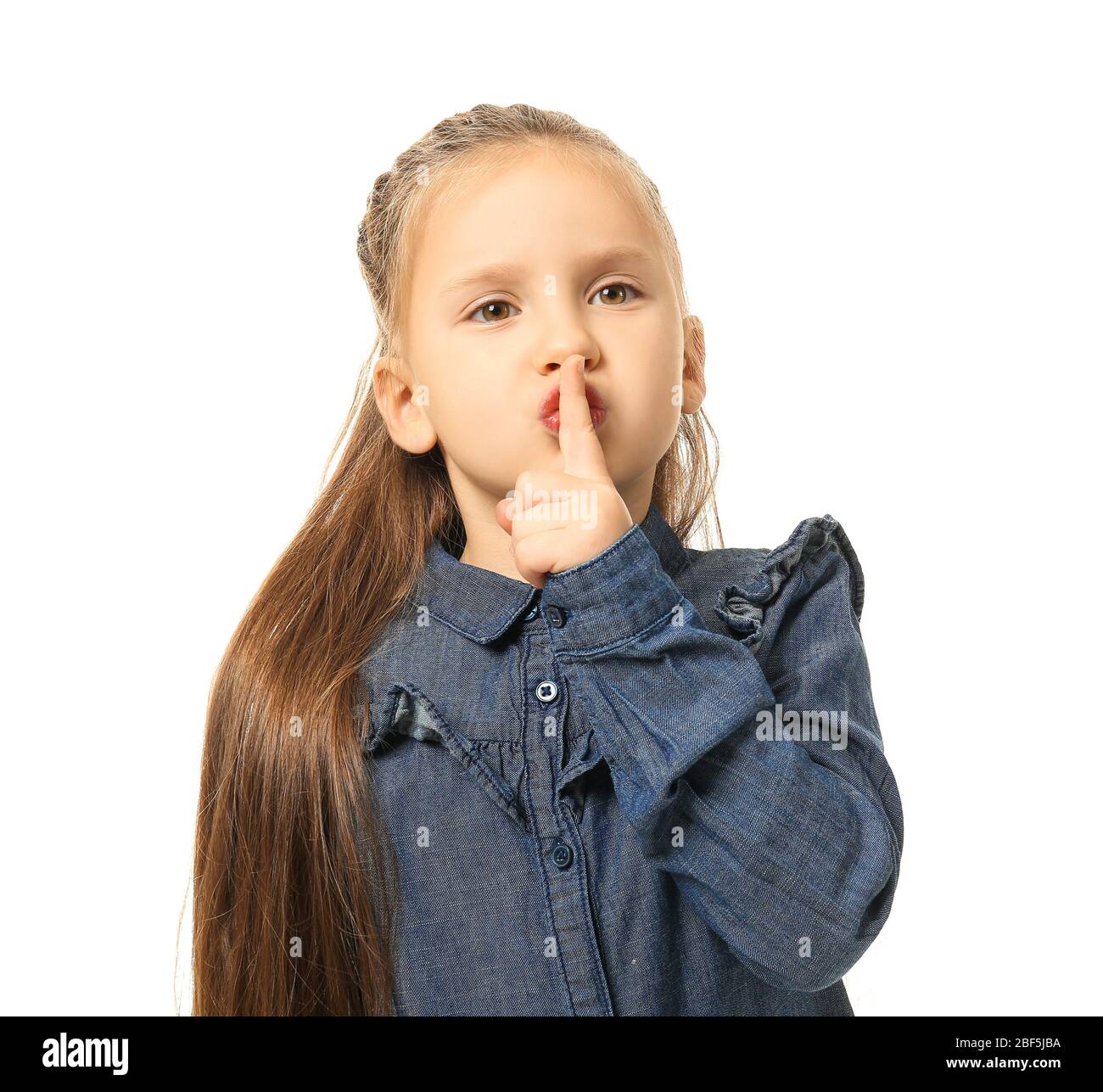 Cute little girl showing silence gesture on white background Stock ...