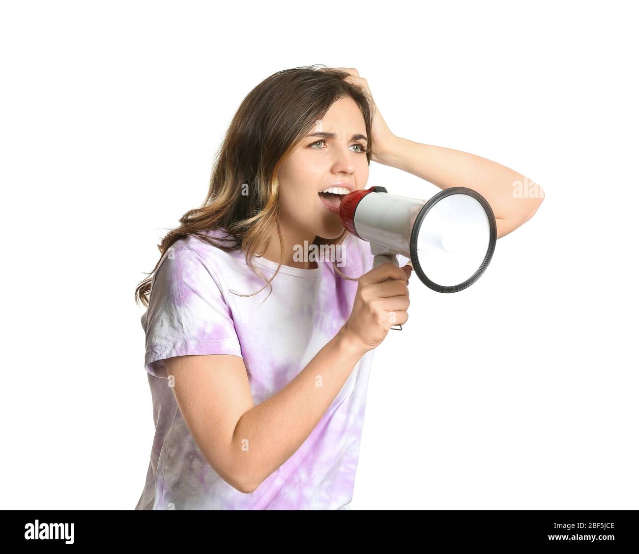 Emotional young woman with megaphone on white background Stock Photo ... Emotional young woman with megaphone on white background Stock Photo ...