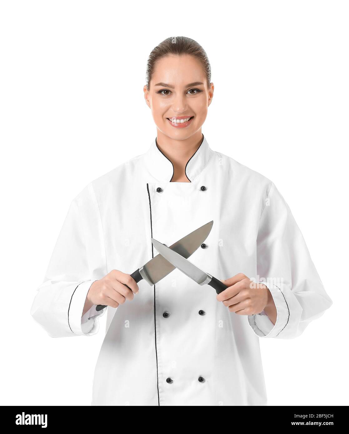 Beautiful female chef with knives on white background Stock Photo - Alamy