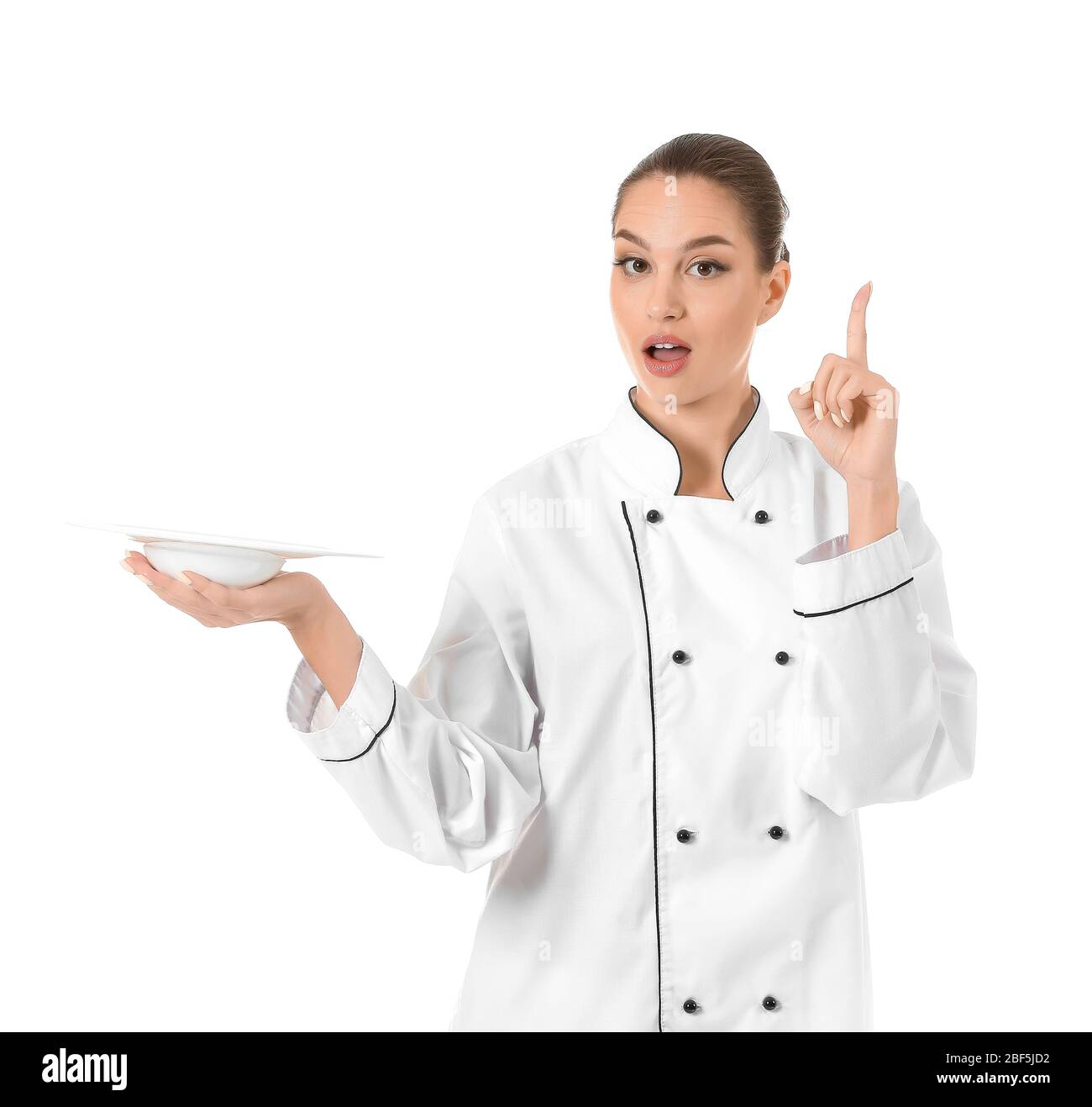 Beautiful female chef with empty plate on white background Stock Photo ...