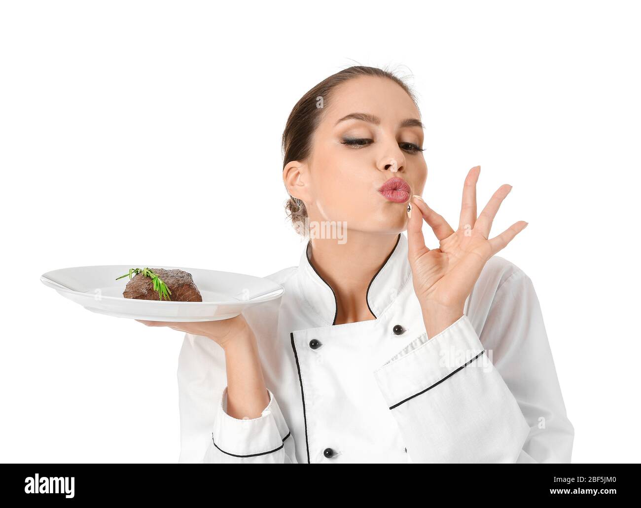 Beautiful female chef with tasty meat on white background Stock Photo ...