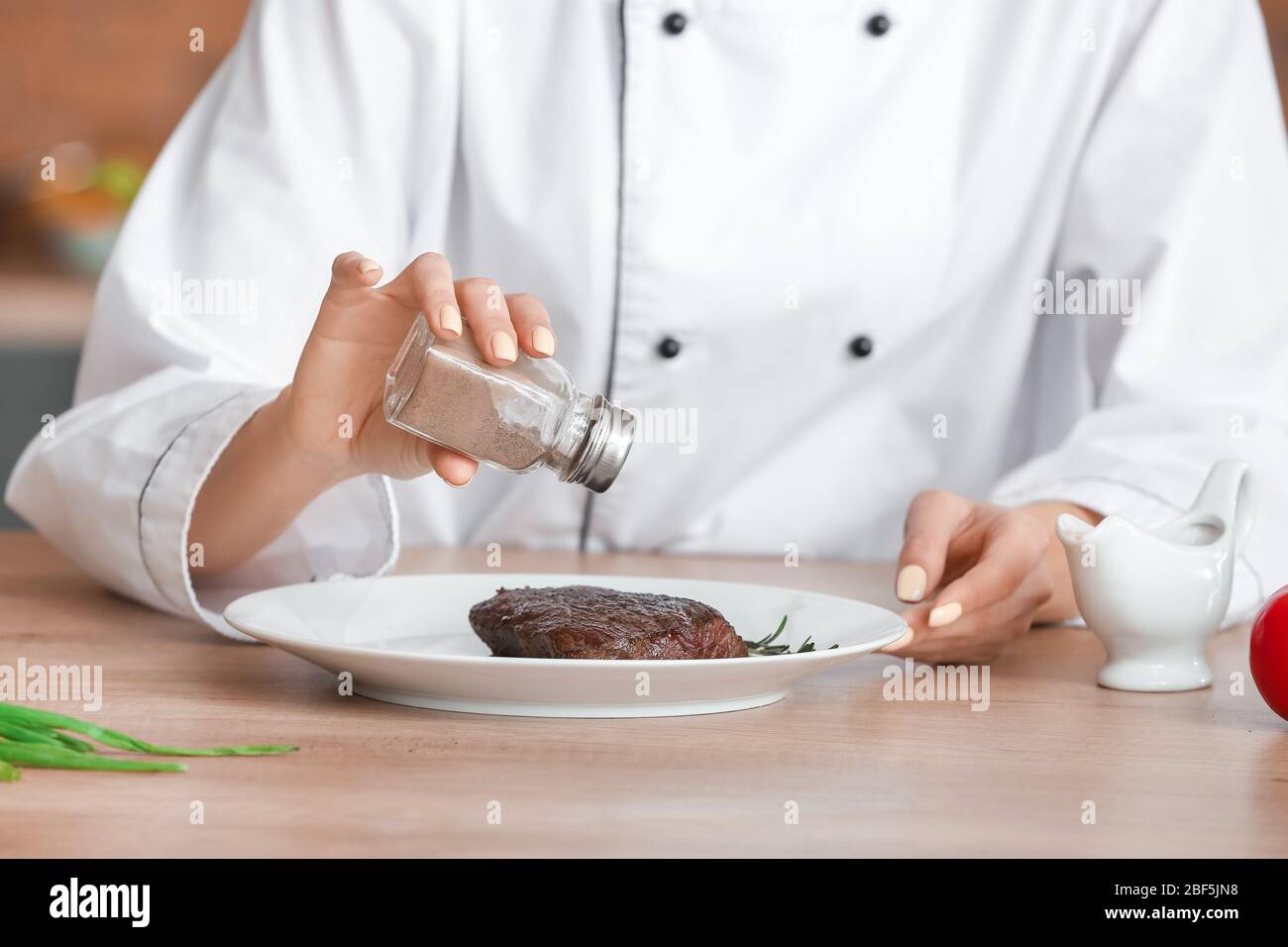 Adding spices meat dish cooking hi-res stock photography and images - Alamy