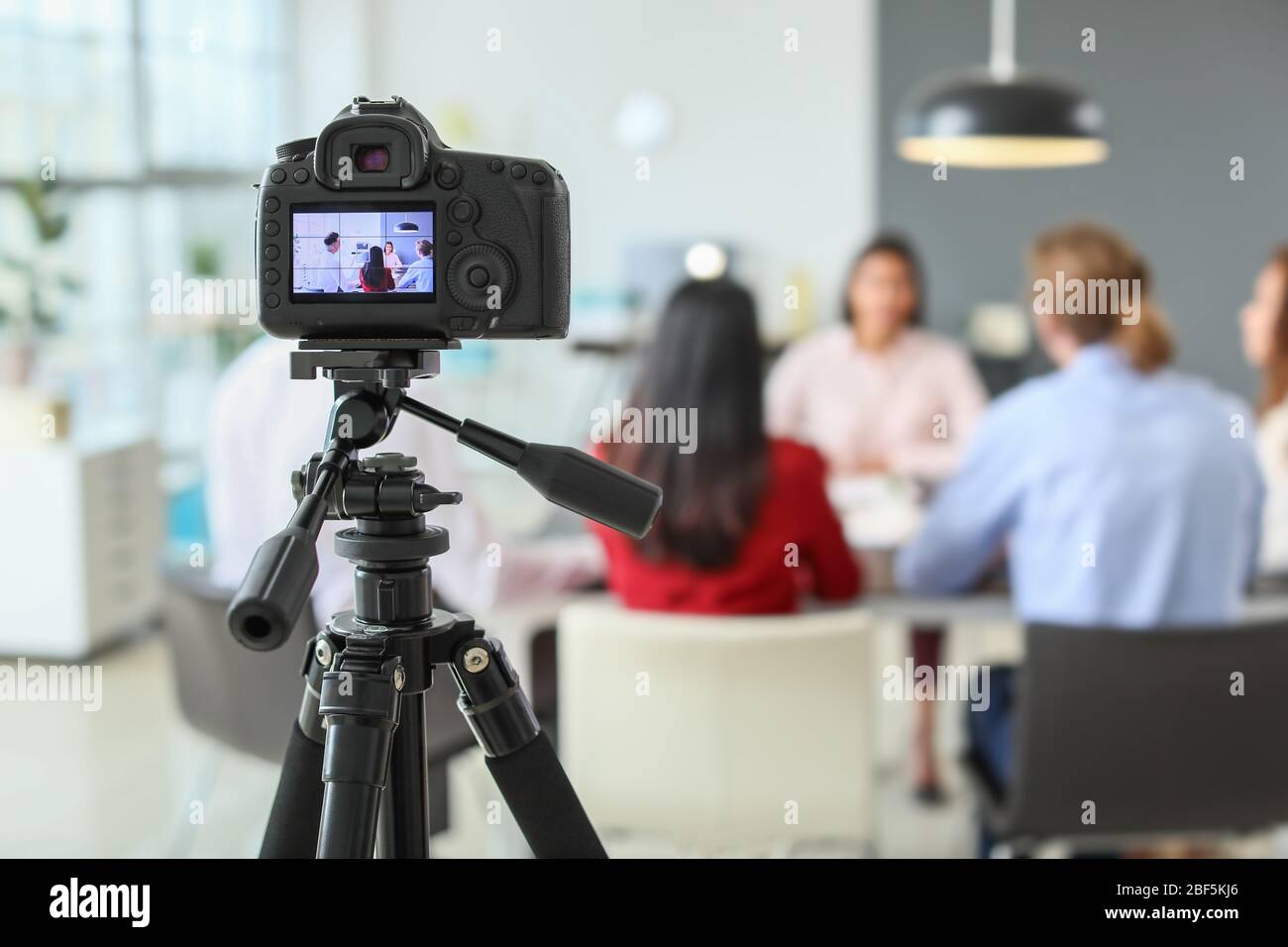 Filming of job interview with applicant in office Stock Photo - Alamy