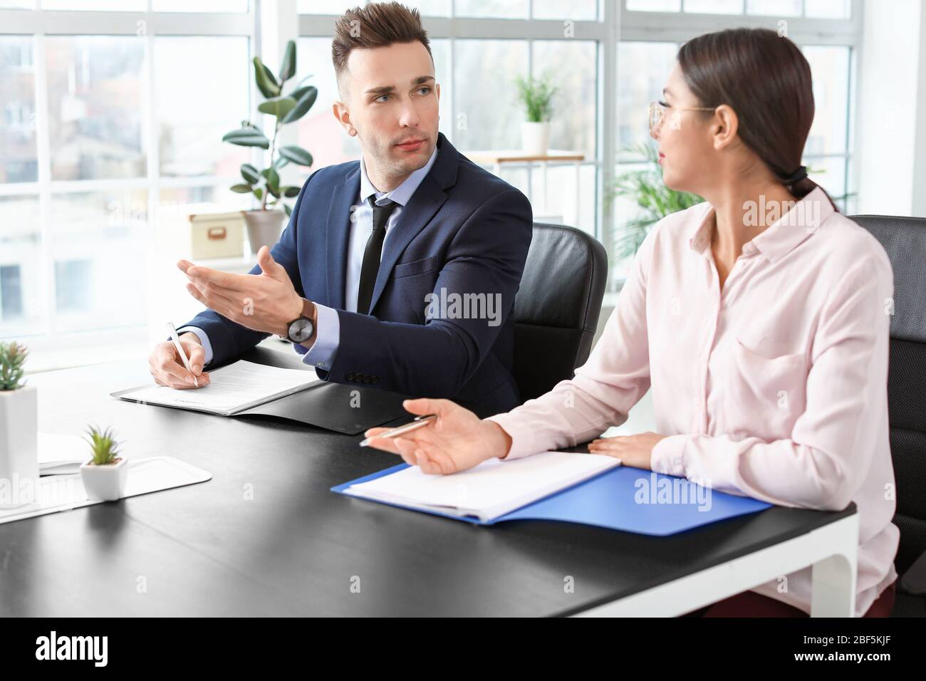 Human resources commission during job interview in office Stock Photo ...