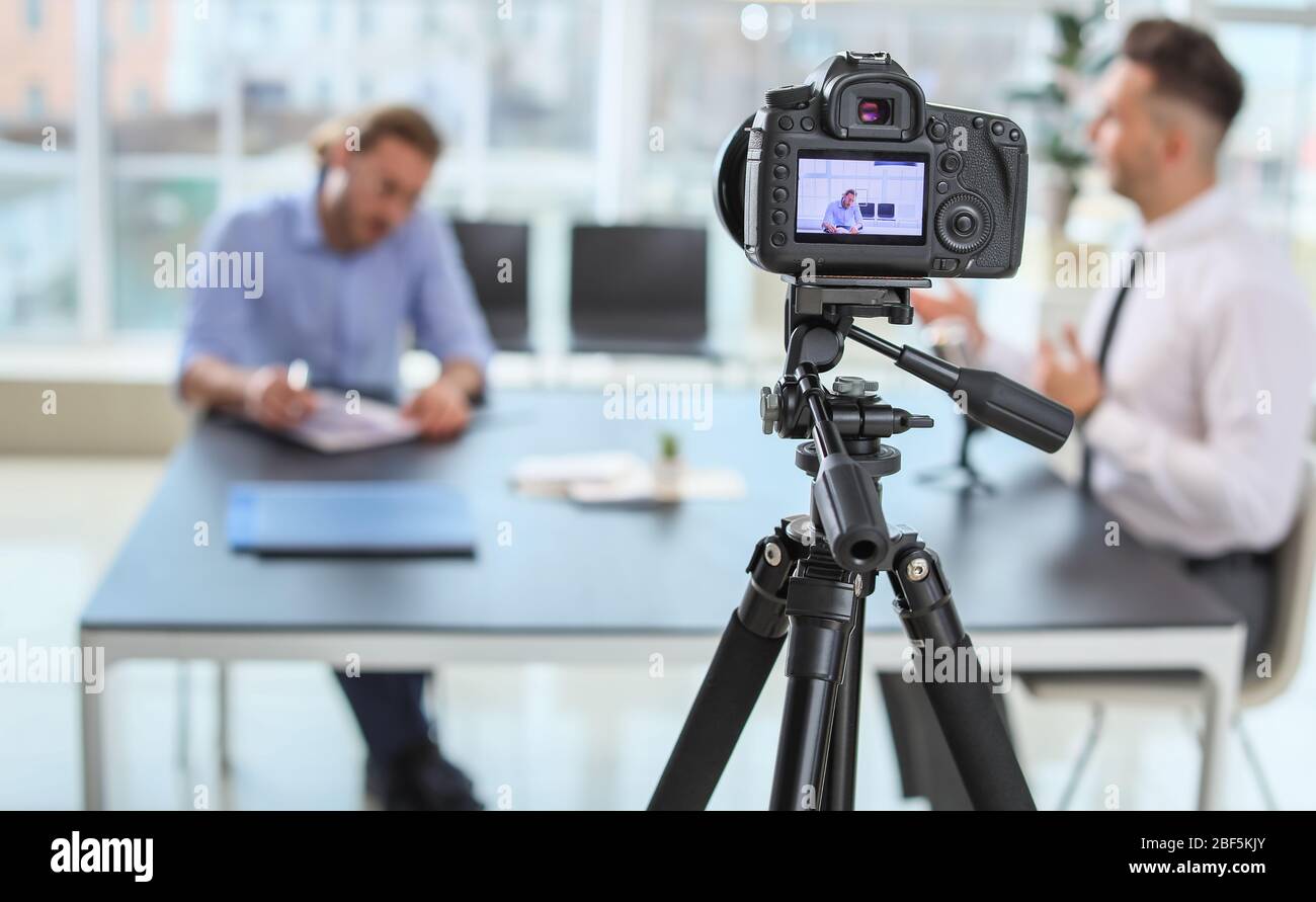 Filming of job interview with applicant in office Stock Photo - Alamy