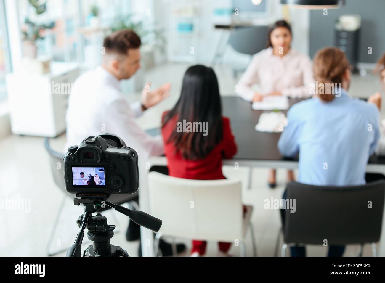 Filming of job interview with applicant in office Stock Photo - Alamy