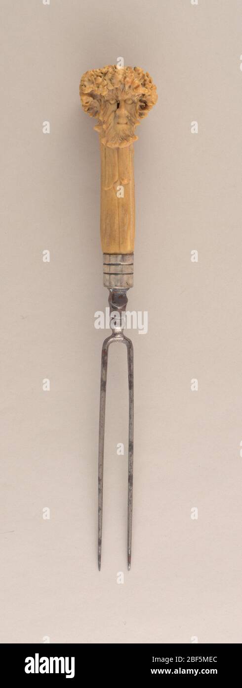 Fork. Long two-tined fork, rounded shoulder, articulated neck. Silver ...