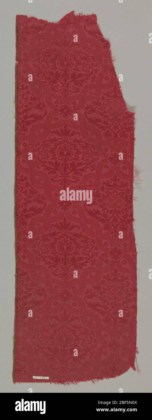 Fragments. Interlaced strapwork forming compartments in red Stock Photo ...