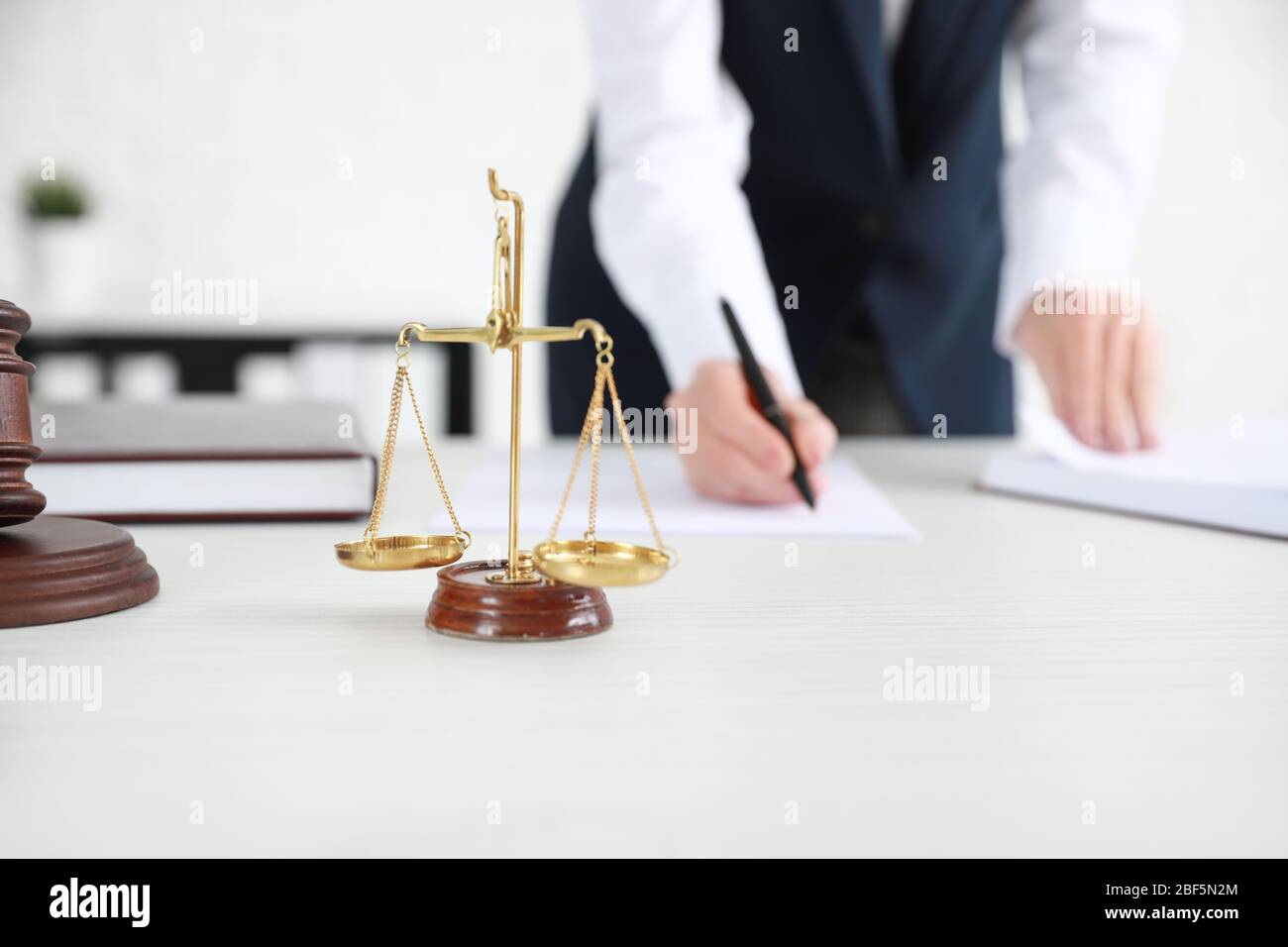 Scales on table of notary public in office Stock Photo - Alamy