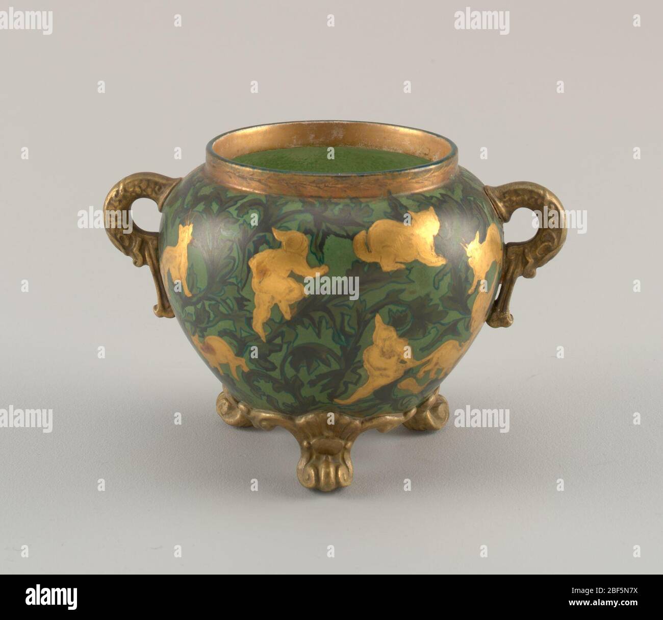 Vase. Footed bulbous jar in green with allover darker green leaf ...