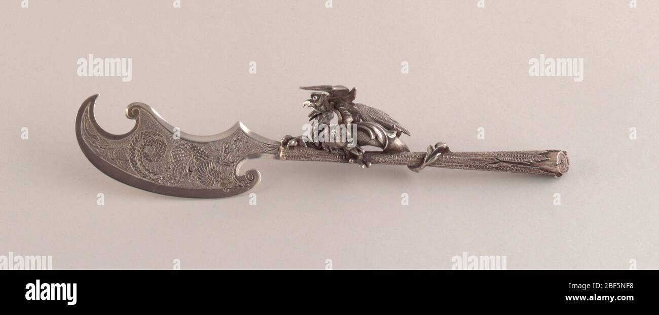 Knife. Modeled dragon figure on handle and engraved dragon on blade ...
