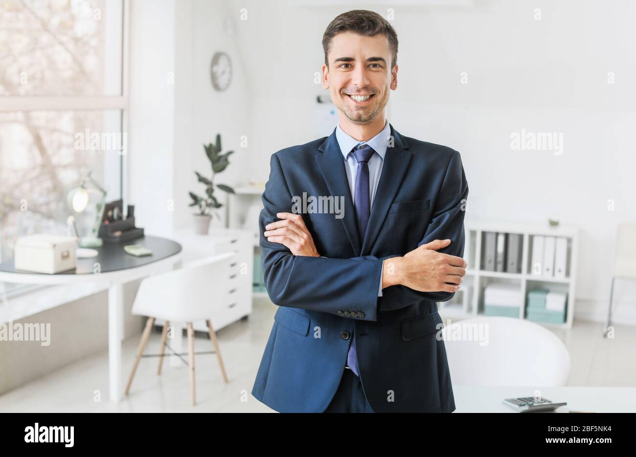 Portrait of male bank manager in office Stock Photo - Alamy
