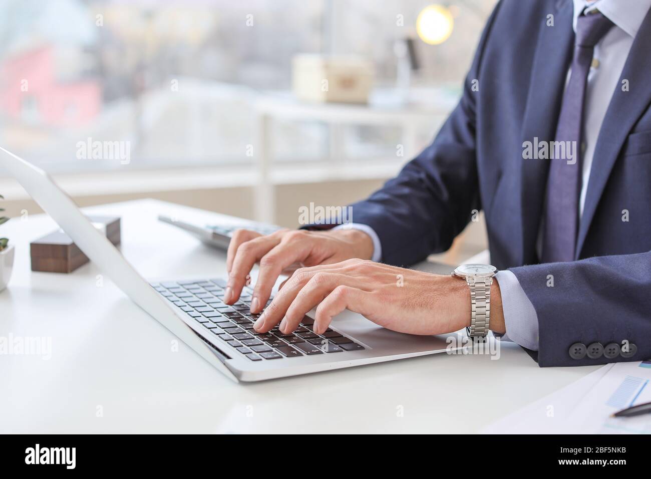 Male bank manager working in office Stock Photo - Alamy