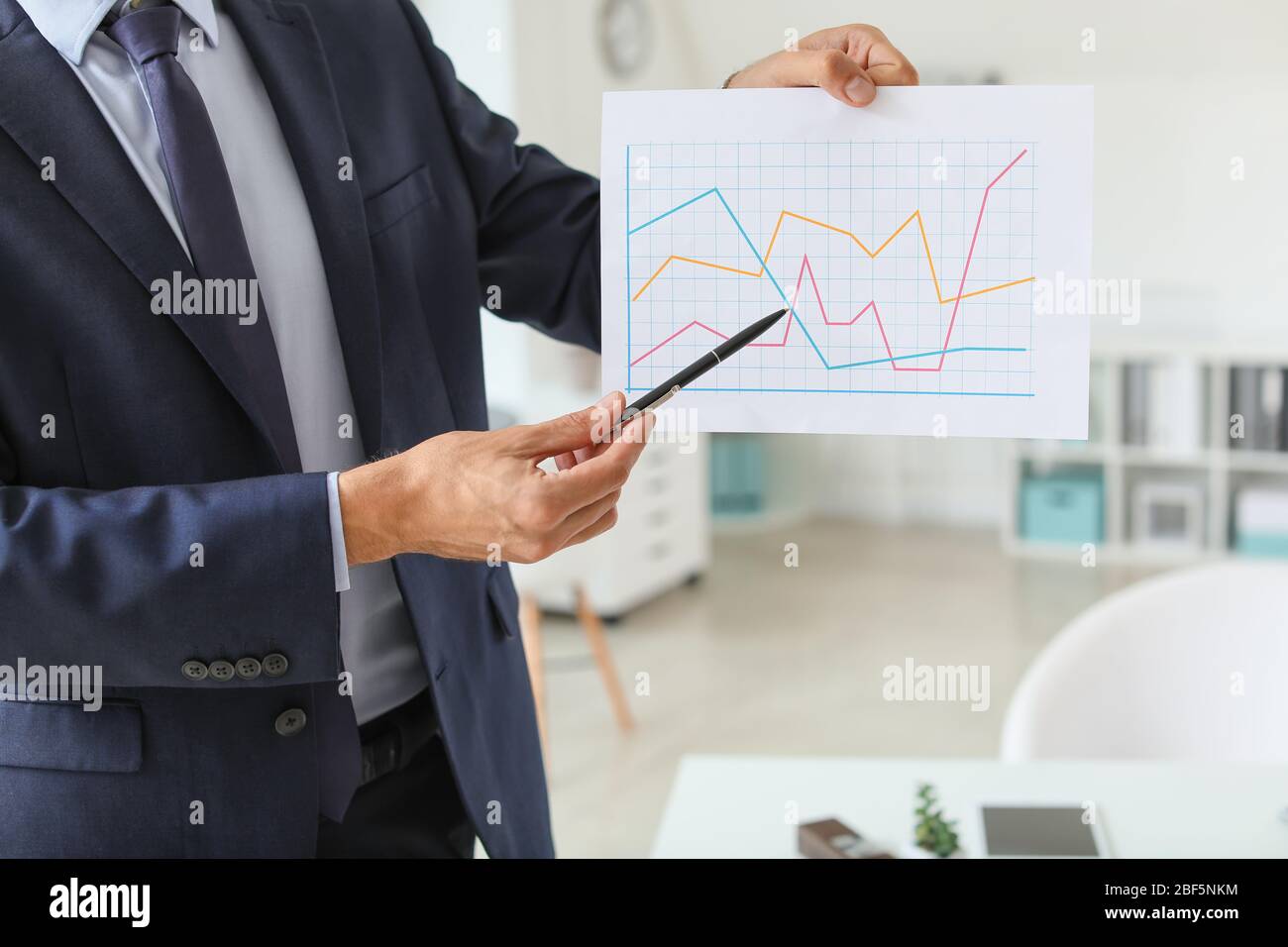 Male bank manager working in office Stock Photo - Alamy
