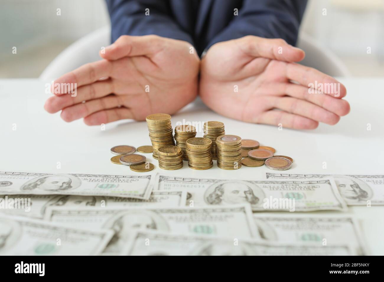 Man Sitting On Stack Dollar High Resolution Stock Photography and ...