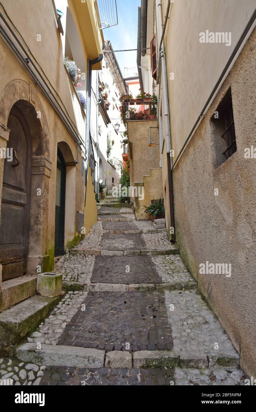 A narrow street between the old houses of Atina, a rural village in the ...