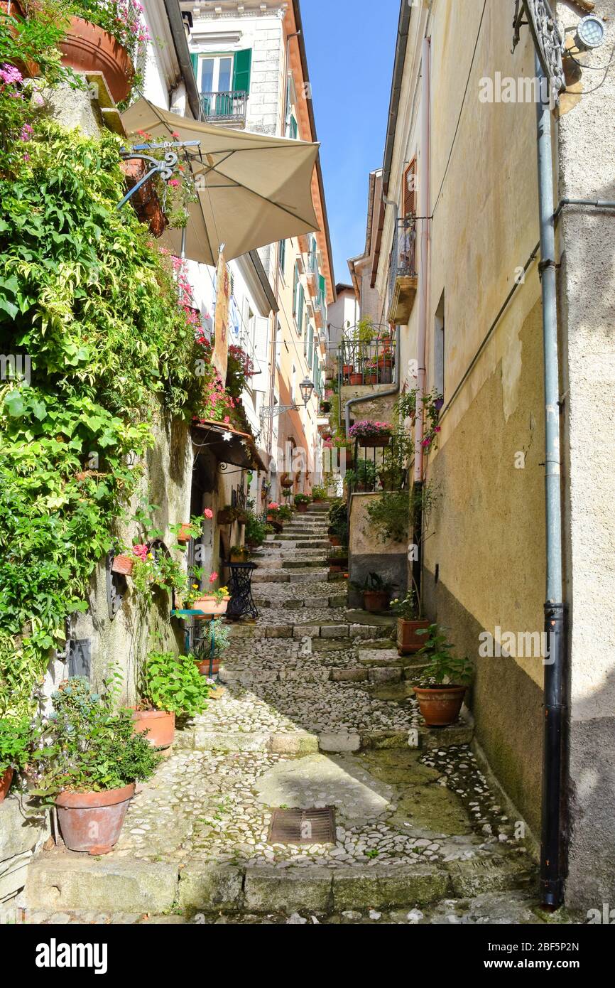 A narrow street between the old houses of Atina, a rural village in the ...