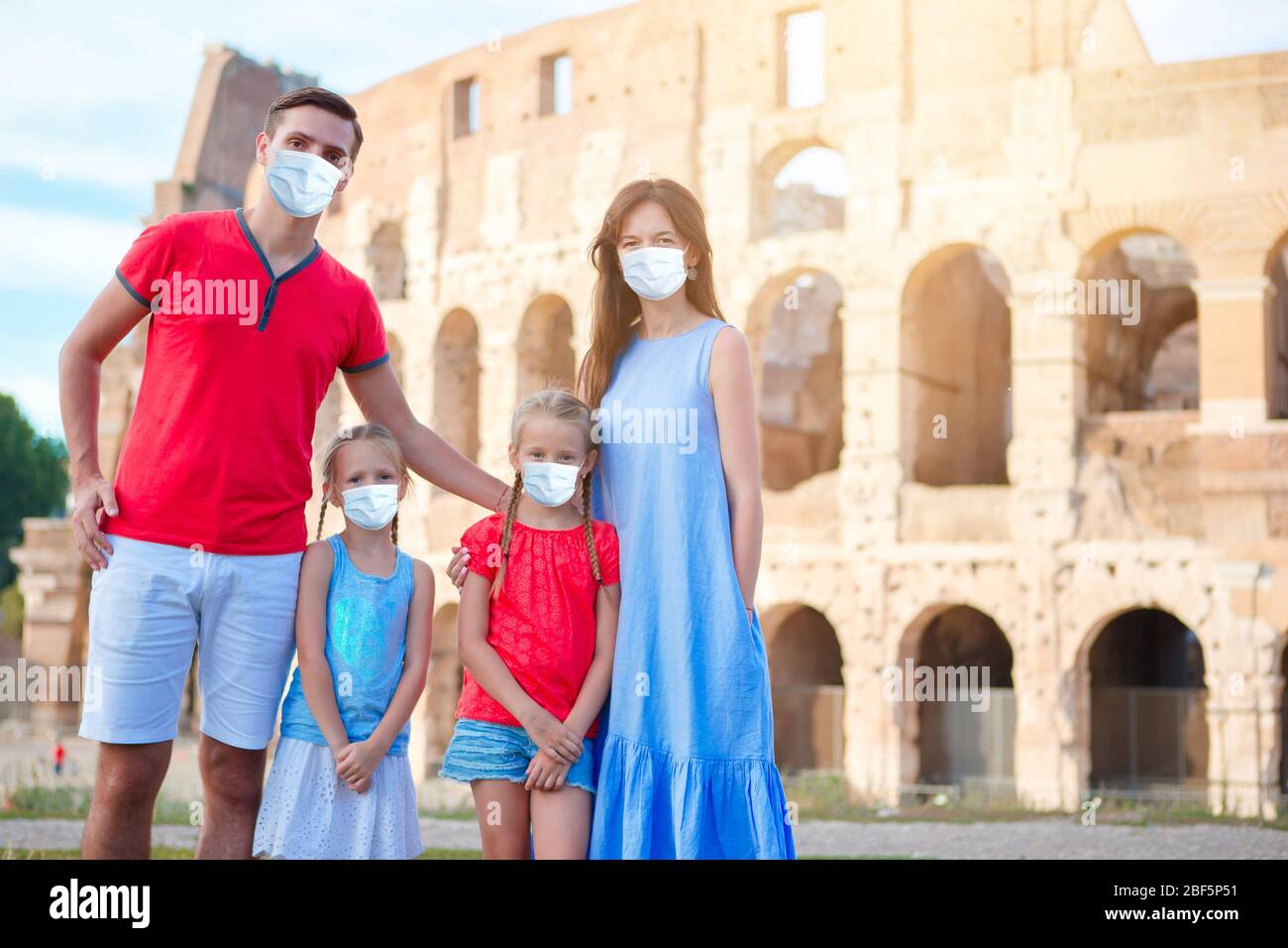 Happy family in Rome over Coliseum background Stock Photo - Alamy