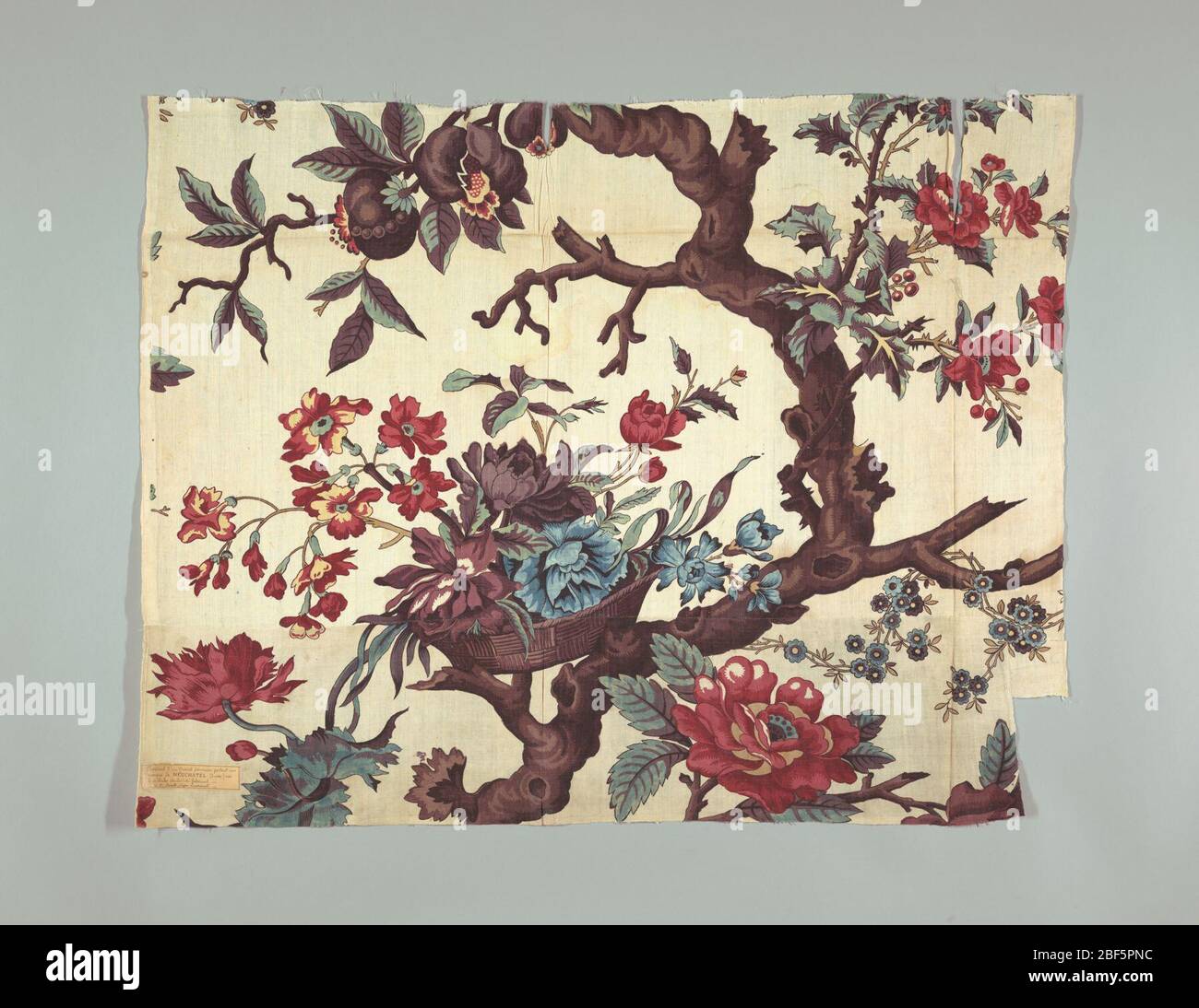 Textile. Curving tree trunk with basket of flowers, exotic blossoms and ...