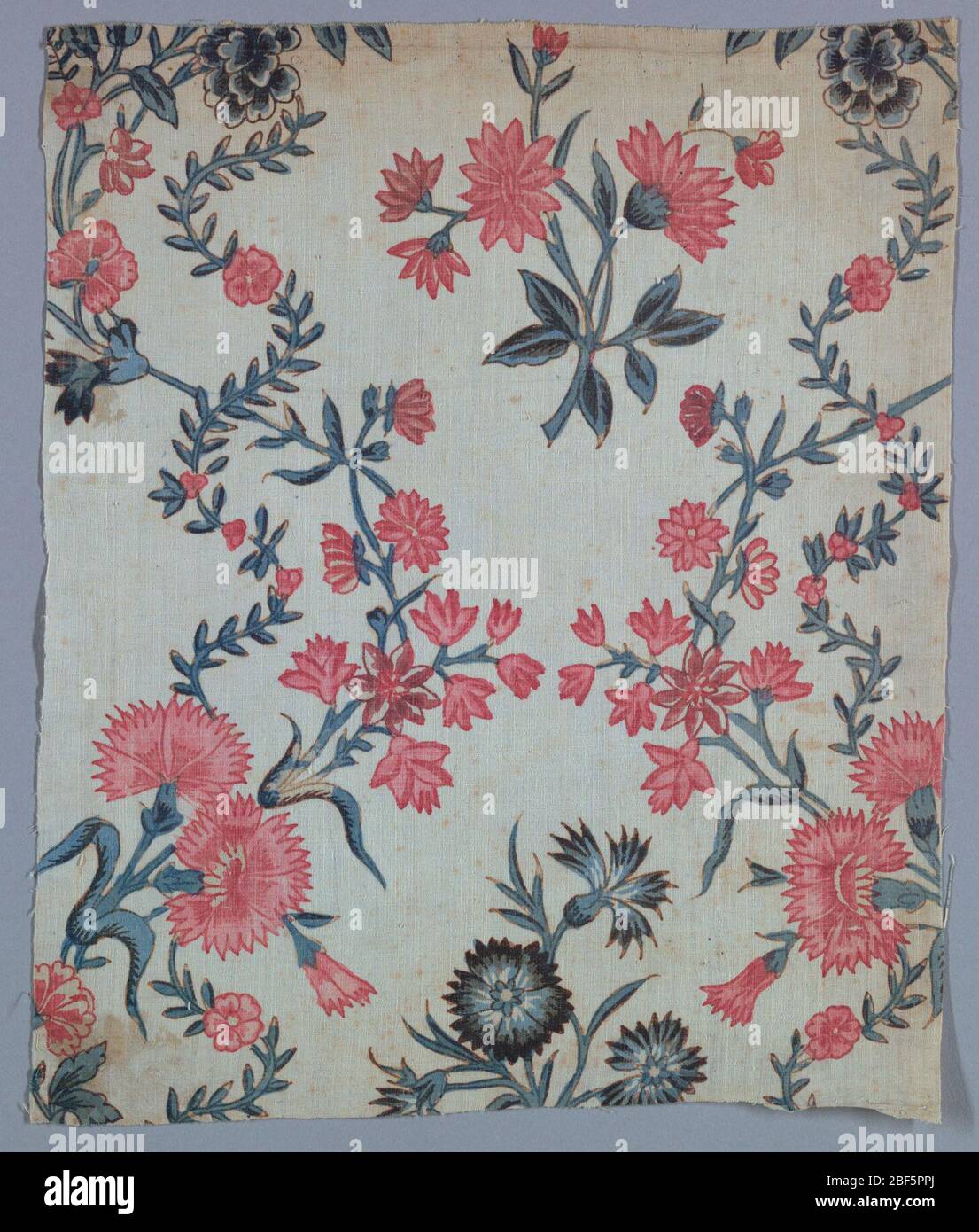 Textile. Design of vines and flowers. The outer parts of the design are ...