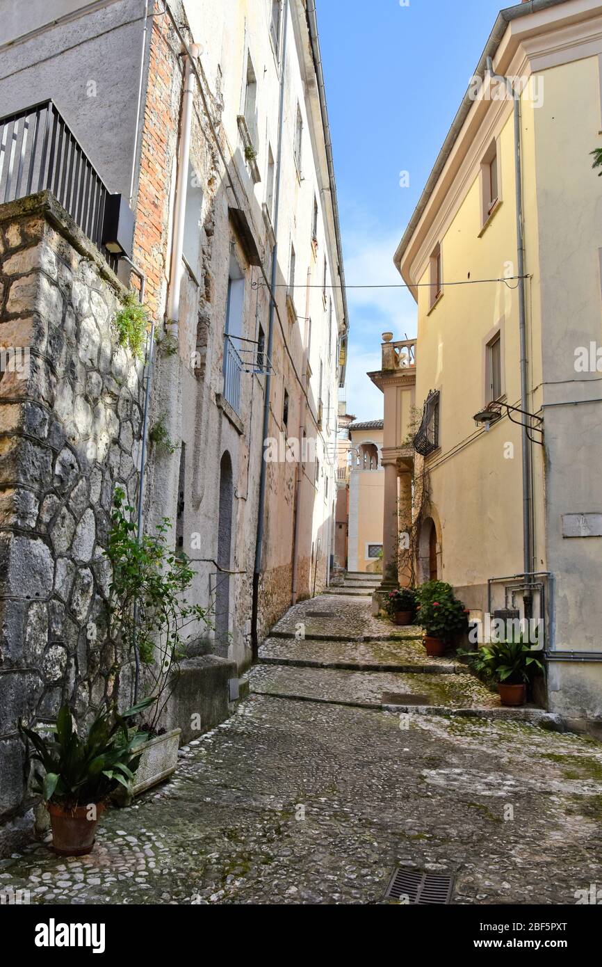 A narrow street between the old houses of Atina, a rural village in the ...