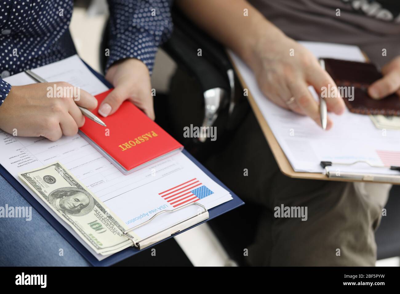 Couple preparing to fill out visa application form Stock Photo - Alamy
