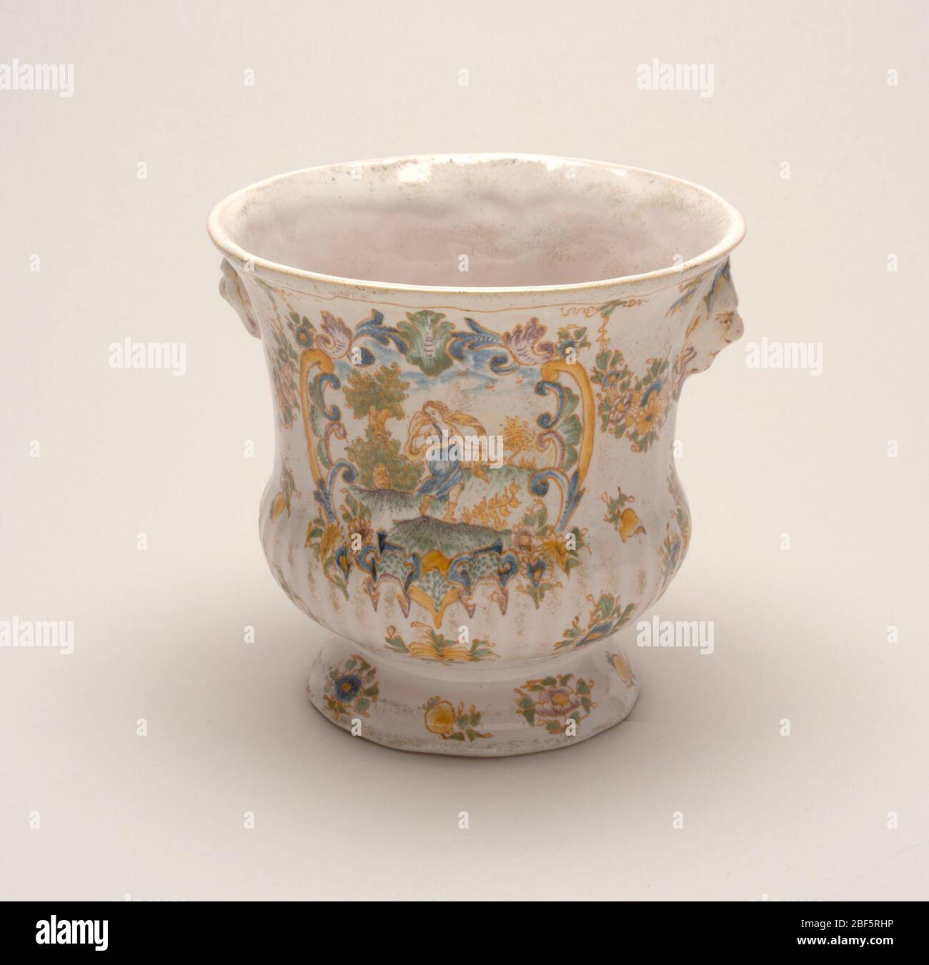 Jardinire. Gadrooned lower body; mascaron below the lip with festoons ...