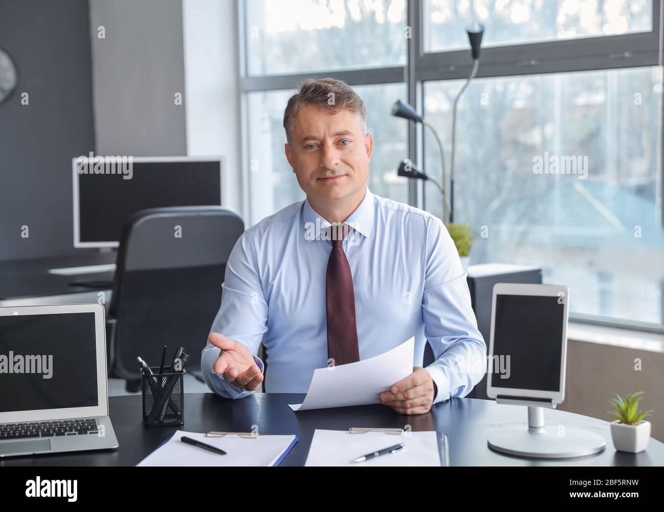 Mature man during job interview in office Stock Photo - Alamy