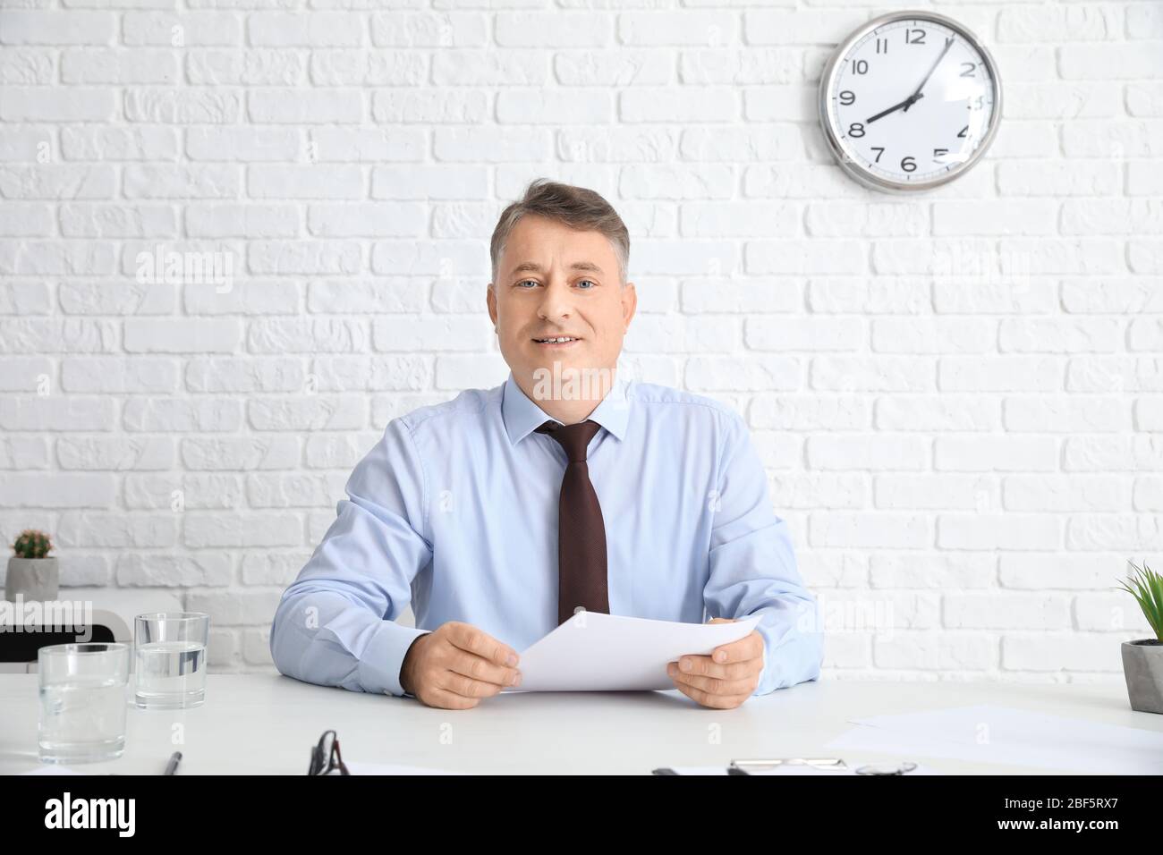 Mature man during job interview in office Stock Photo - Alamy