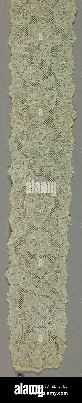 Cap streamers. Pair of bobbin lace lappets joined, floral vine; mid ...