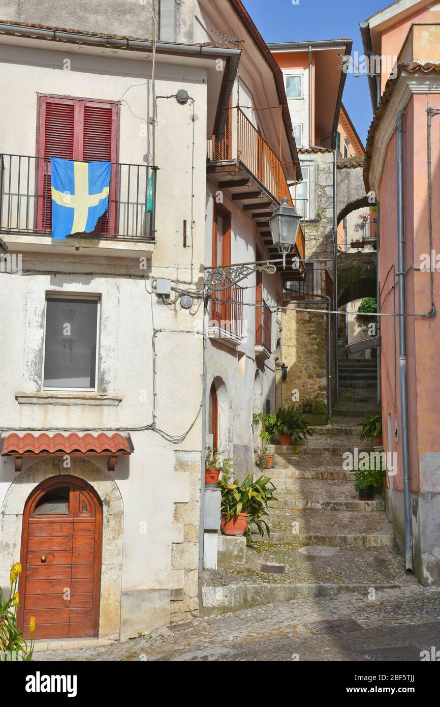 A narrow street between the old houses of Atina, a rural village in the ...
