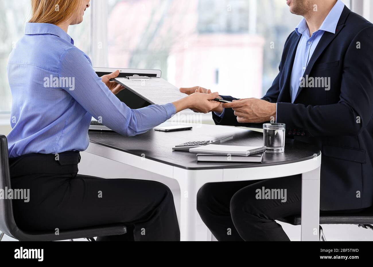 Bank manager working with man in office Stock Photo - Alamy