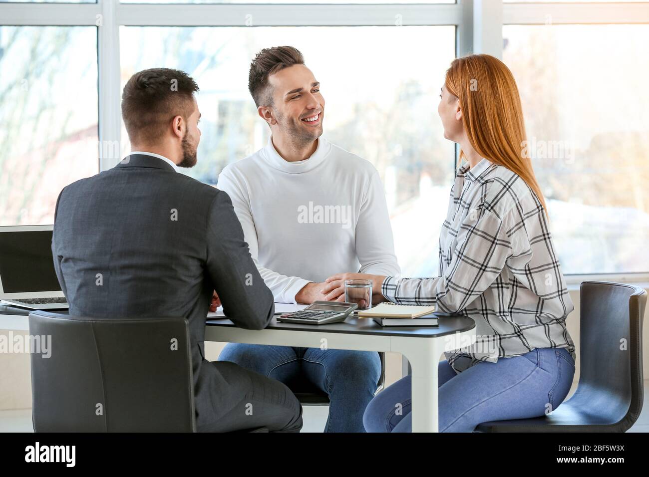 Bank manager sitting with family hi-res stock photography and images ...