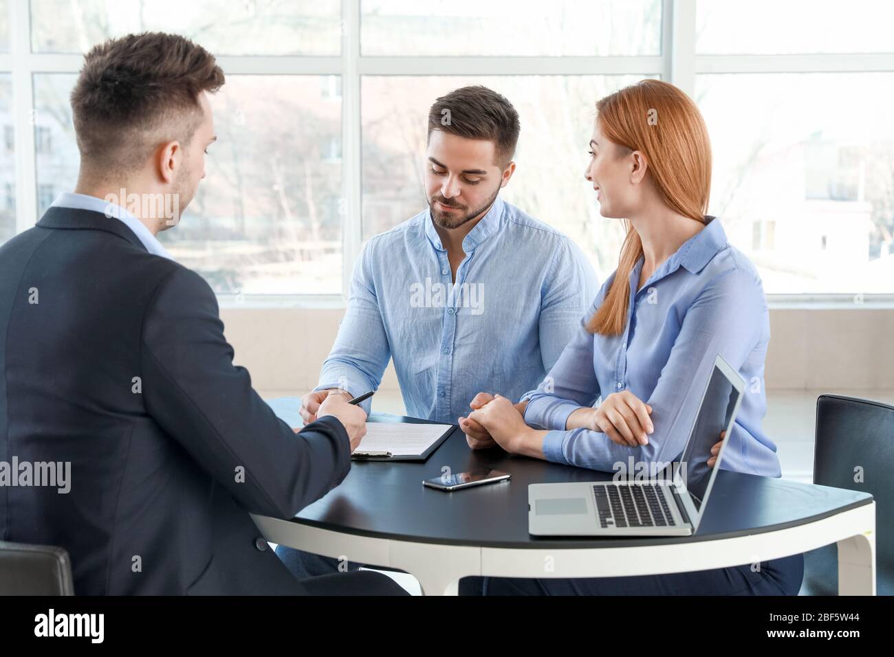 Bank manager sitting with family hi-res stock photography and images ...