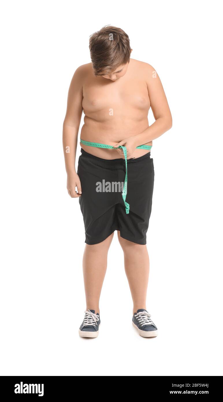 Overweight boy measuring his waist on white background Stock Photo - Alamy