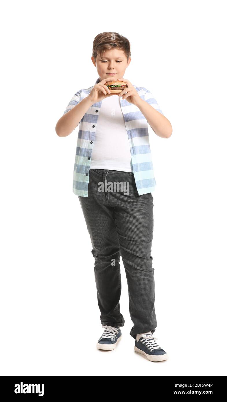 Overweight boy with burger on white background Stock Photo - Alamy