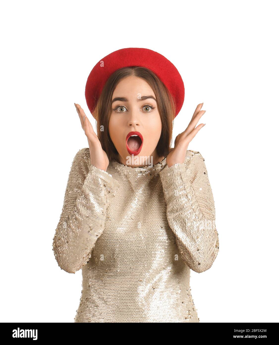 Surprised young woman on white background Stock Photo - Alamy